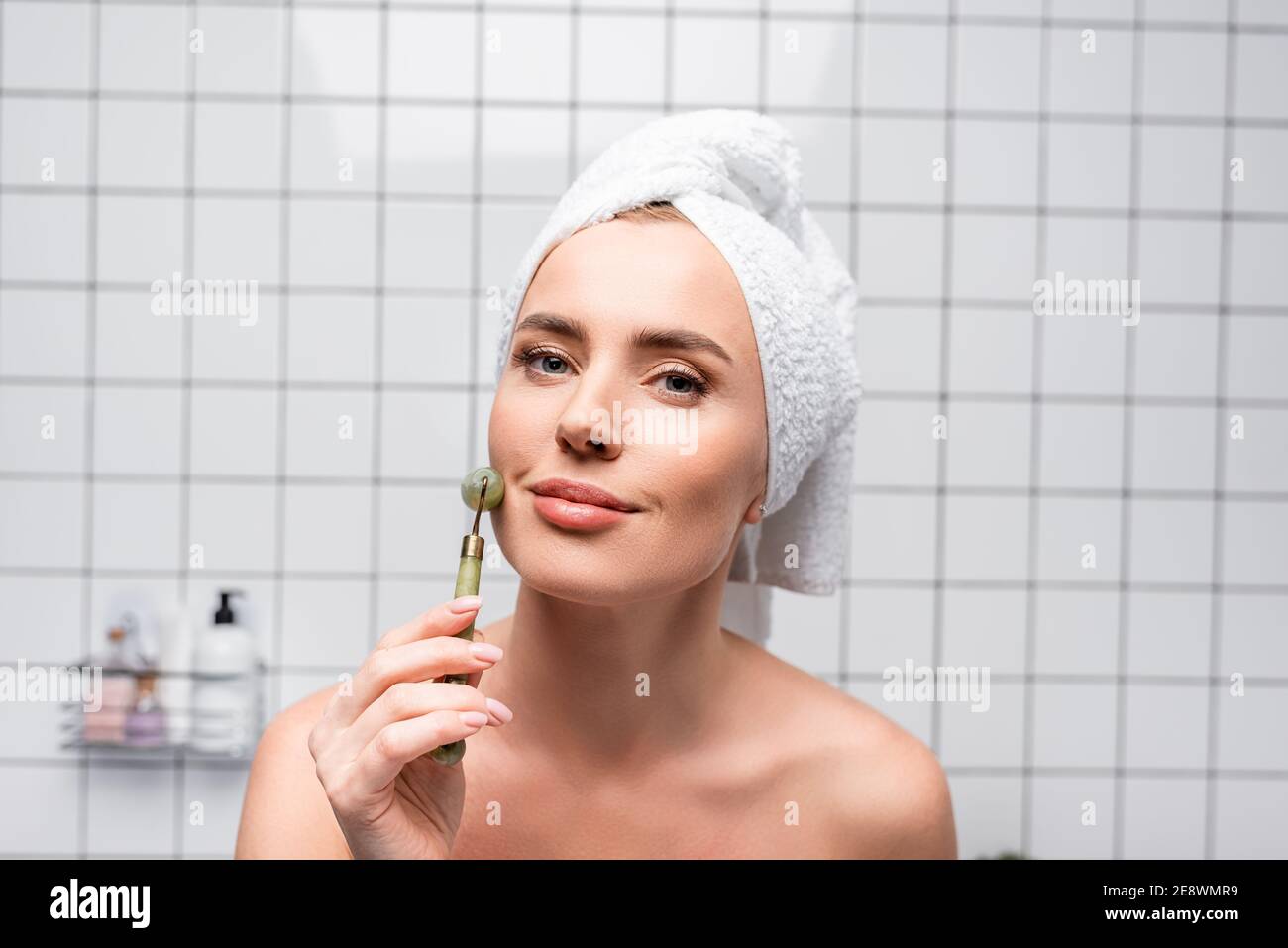 Woman using bathroom towel hi-res stock photography and images - Alamy