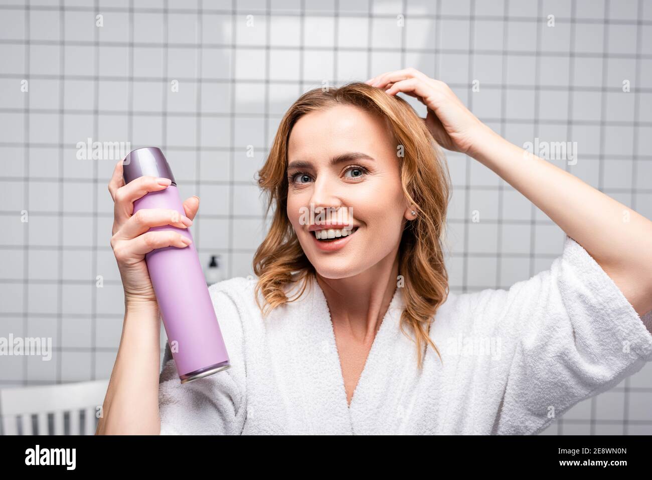 Happy caucasian woman apply spray hi-res stock photography and images ...