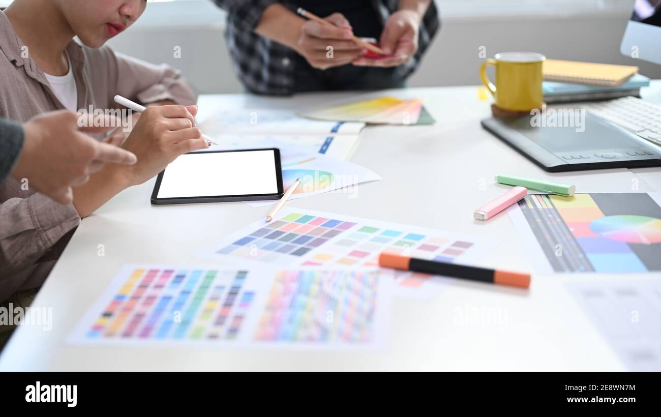 Group of creative graphic designer choosing a color with a color ...