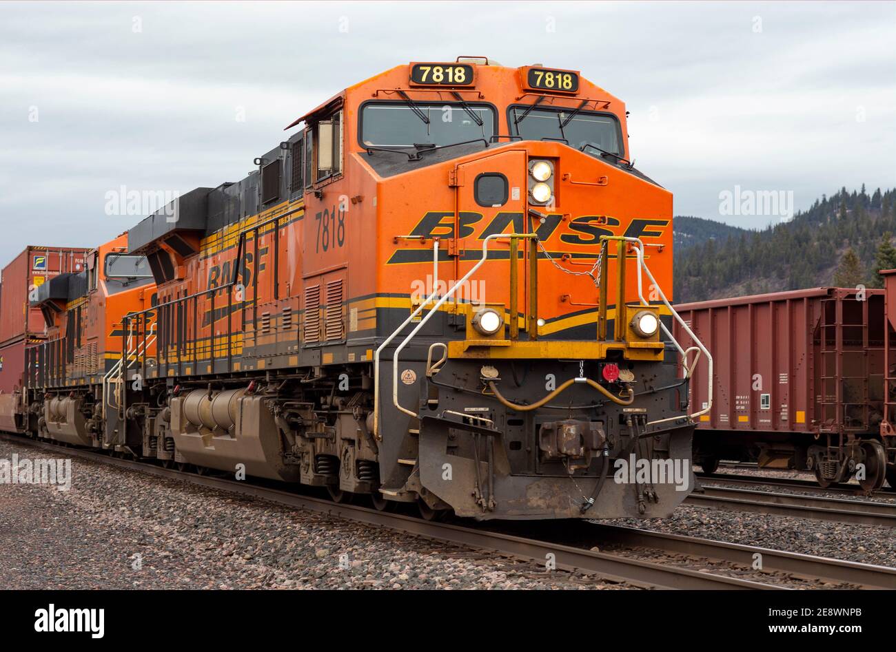 A BNSF train diesel electric locomotive pulling a line of container ...