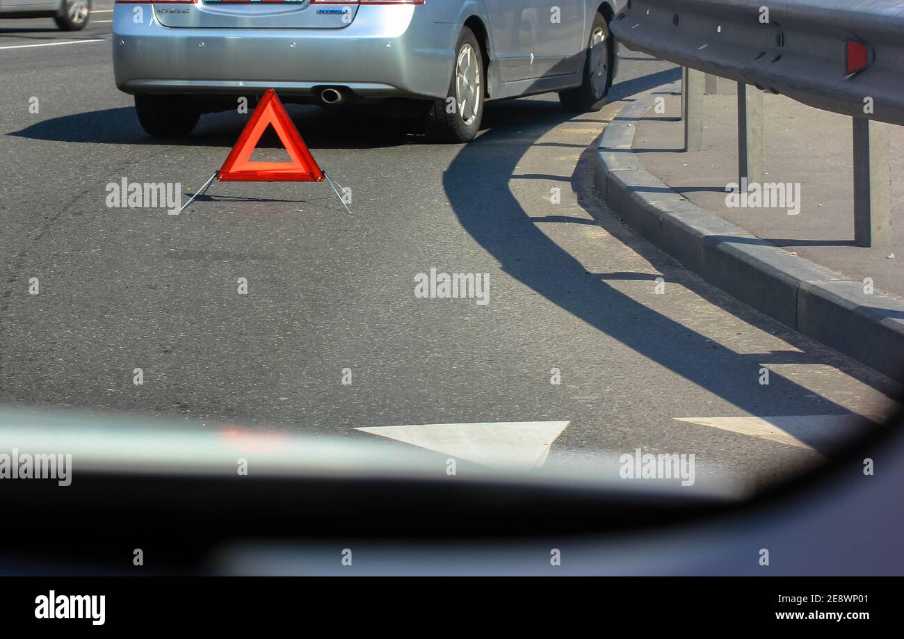 Road traffic accident: emergency stop sign, retroreflective red ...