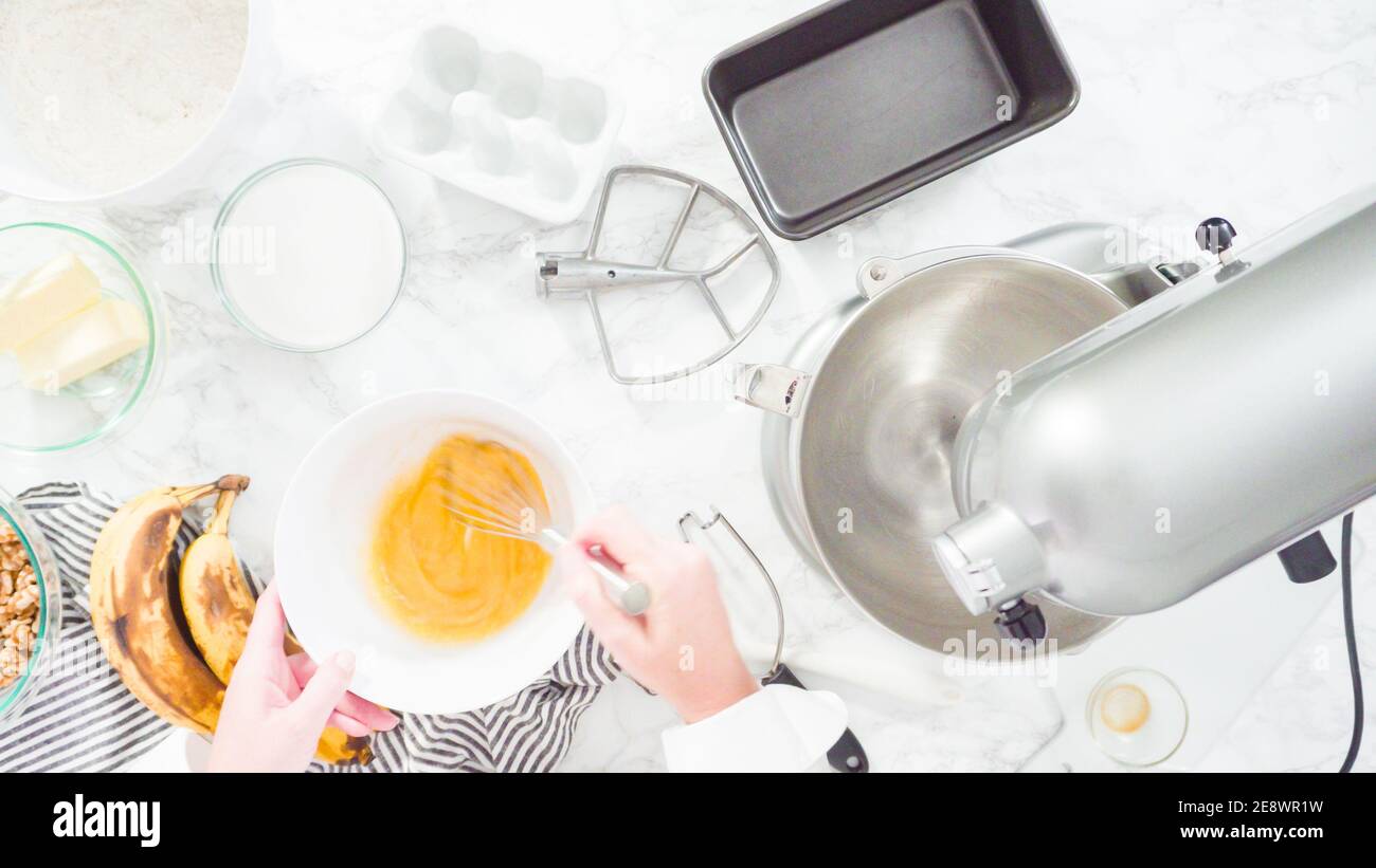 Flat lay. Step by step. Mixing ingredients together into a metal mixing ...