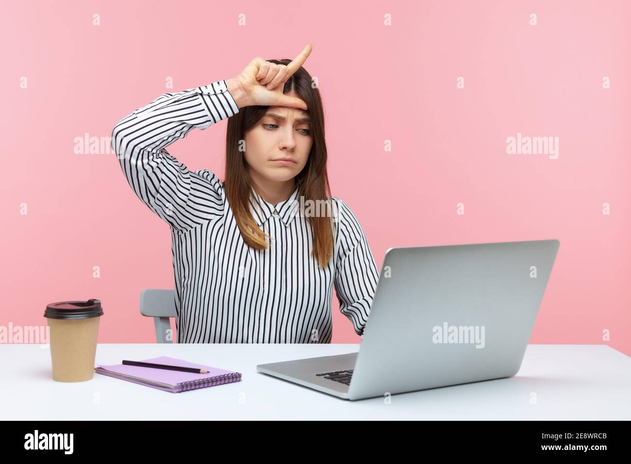Depressed upset woman office worker showing loser gesture communicating ...