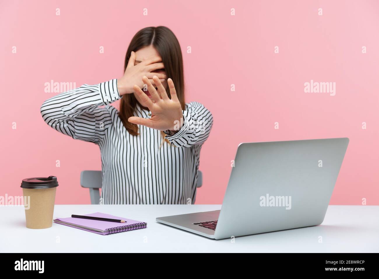 I dont want to look at this. Nervous woman office worker closing eyes ...