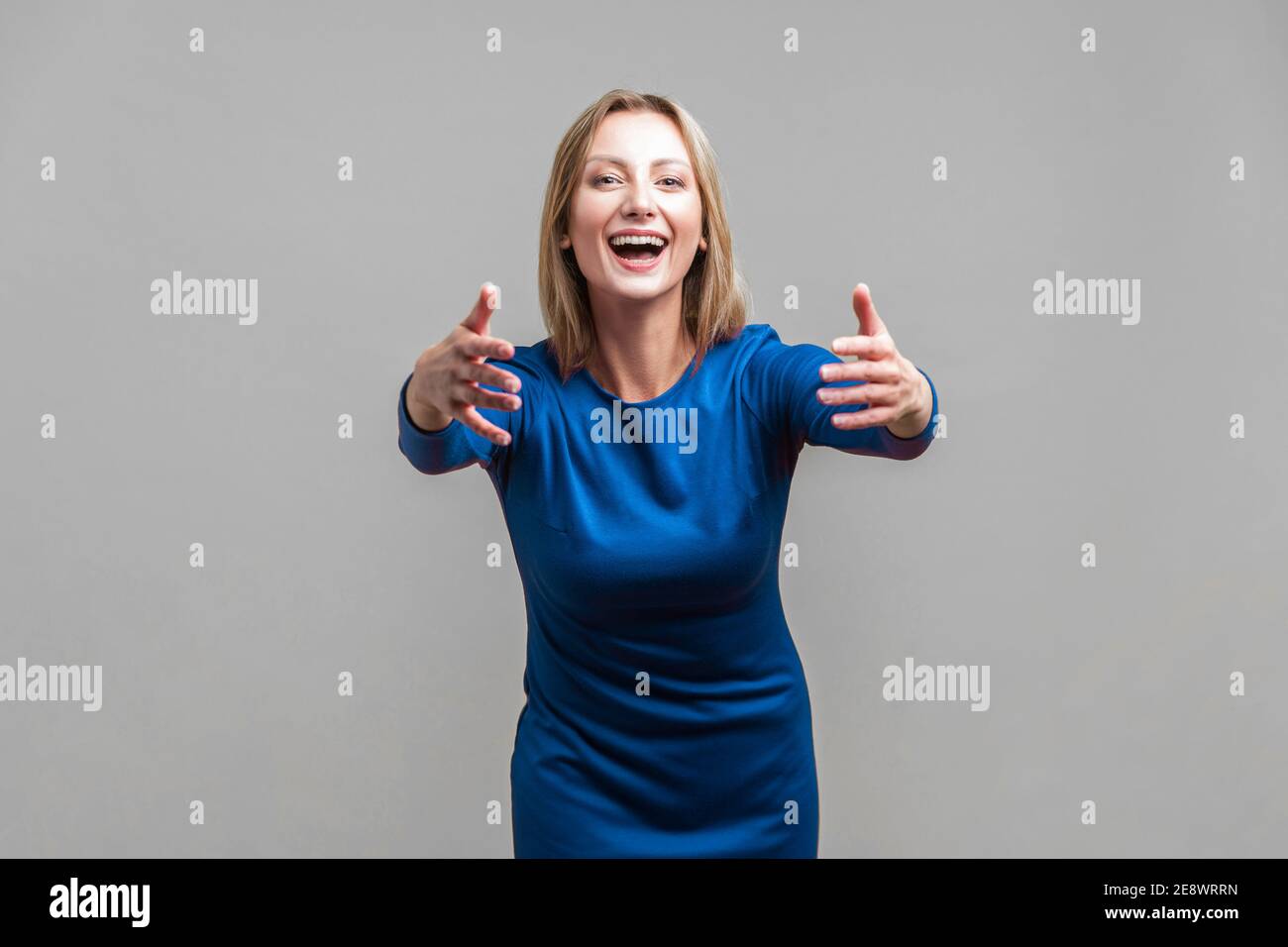 Come into my arms, free hugs! Portrait of adorable hospitable woman in ...