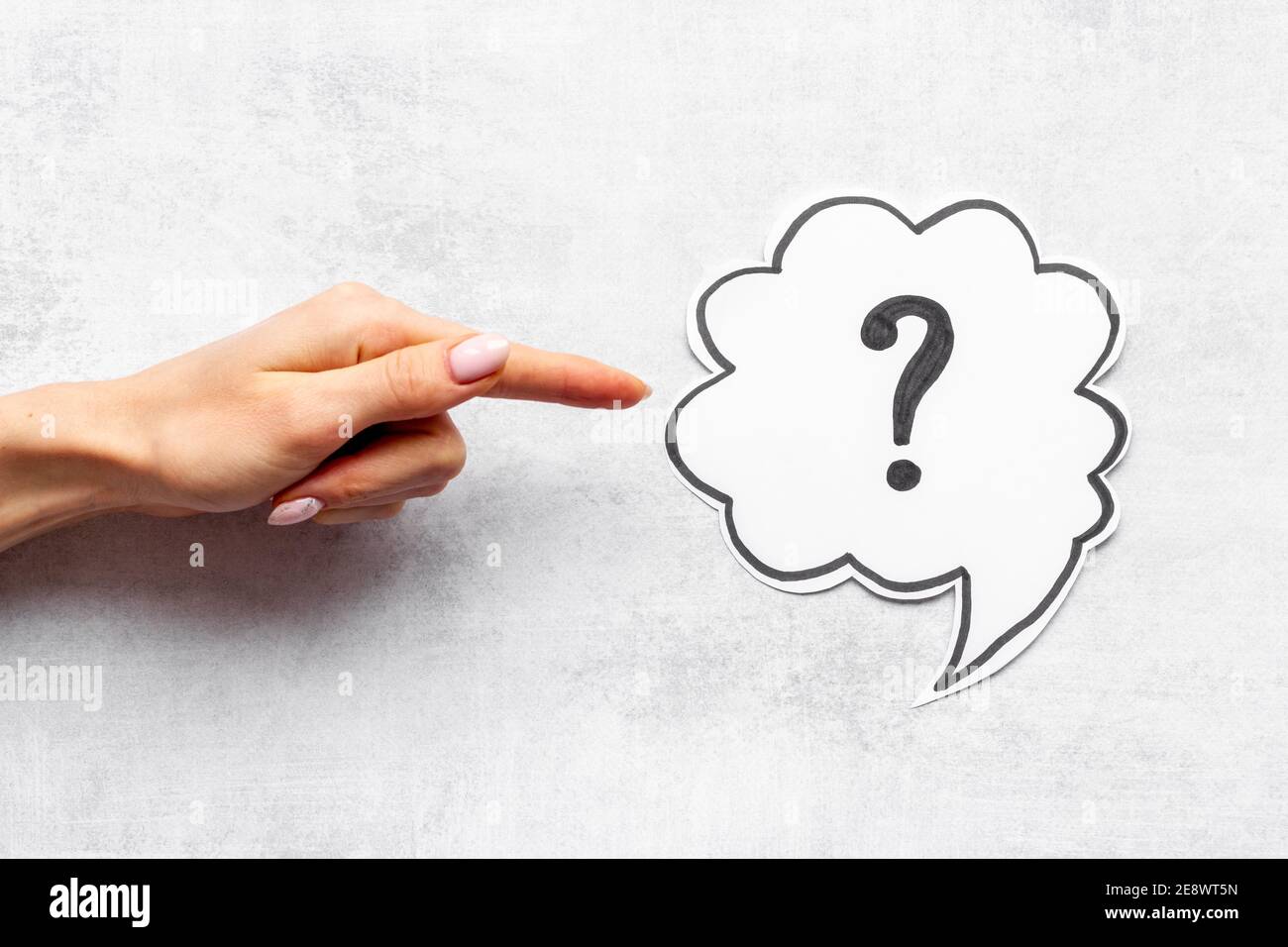 Question mark with hand pointing to a sign. FAQ or search information ...