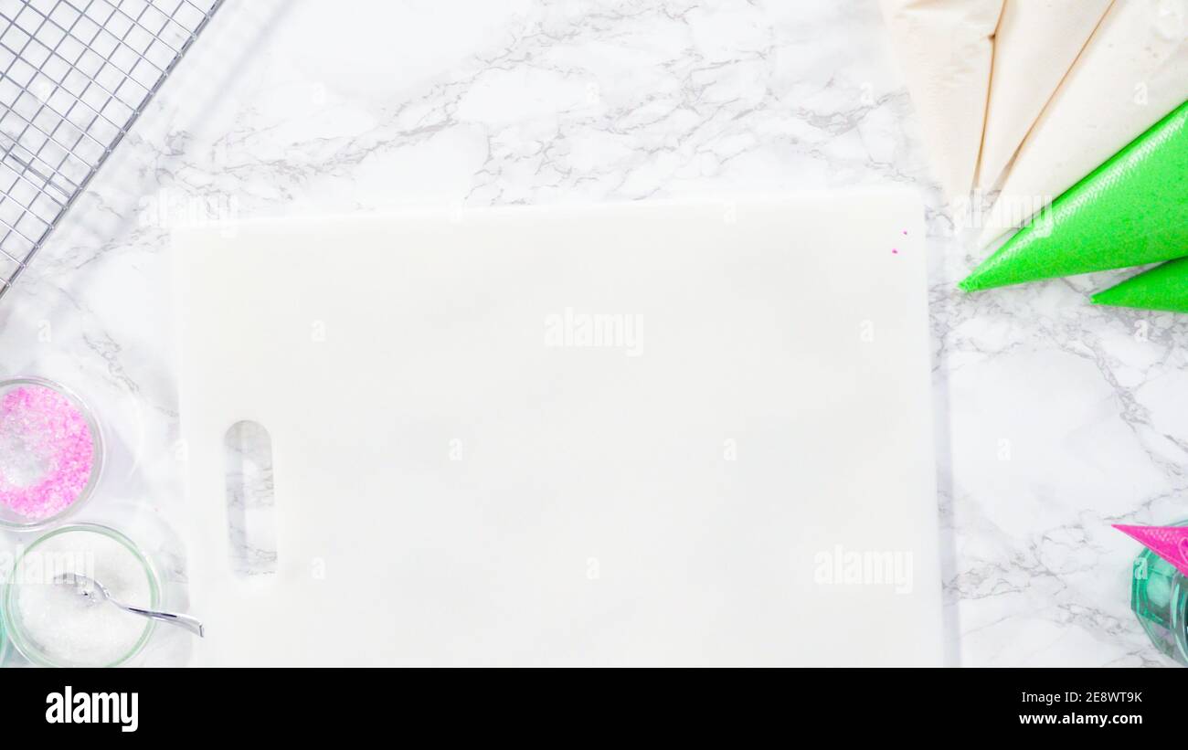 Flat lay. Stp by step. Icing Christmas tree-shaped sugar cookies with ...