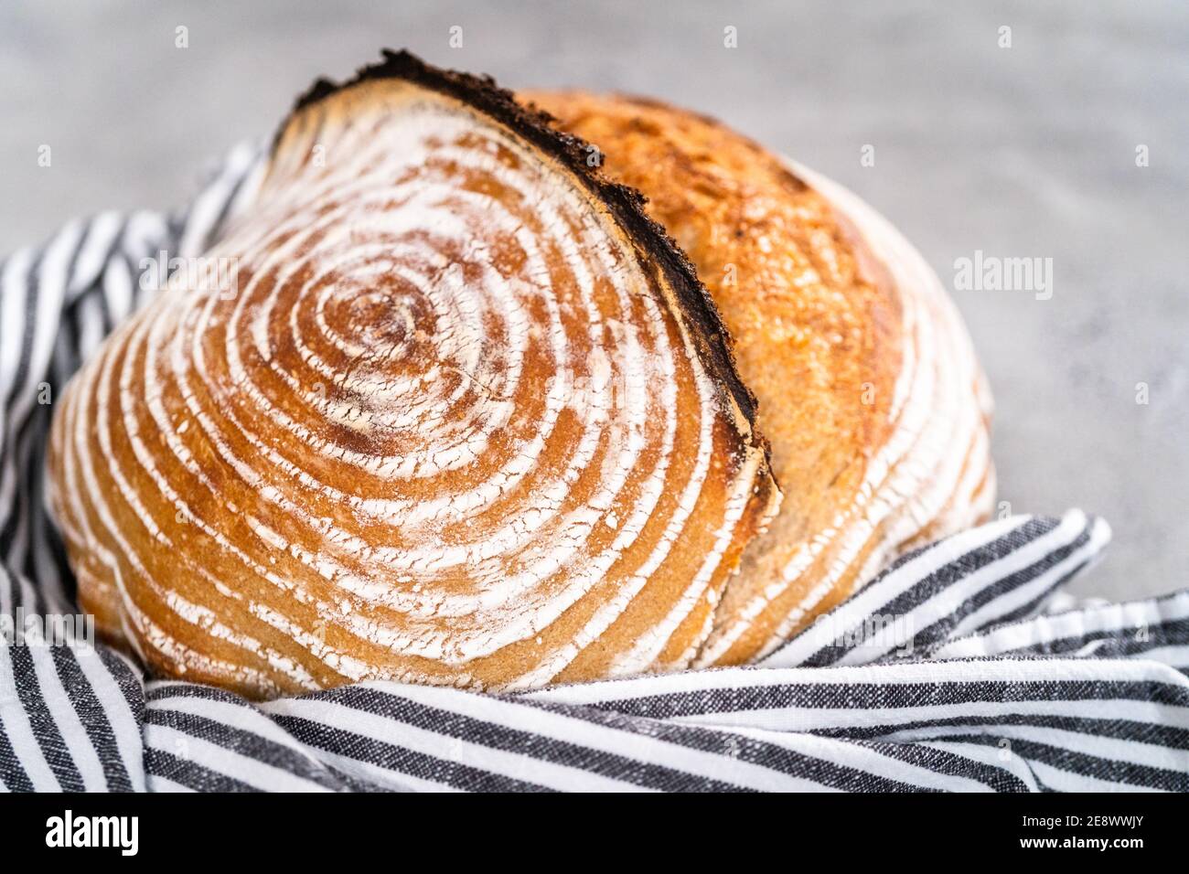 Freshly baked loaf of a wheat sourdough bread with marks from bread ...