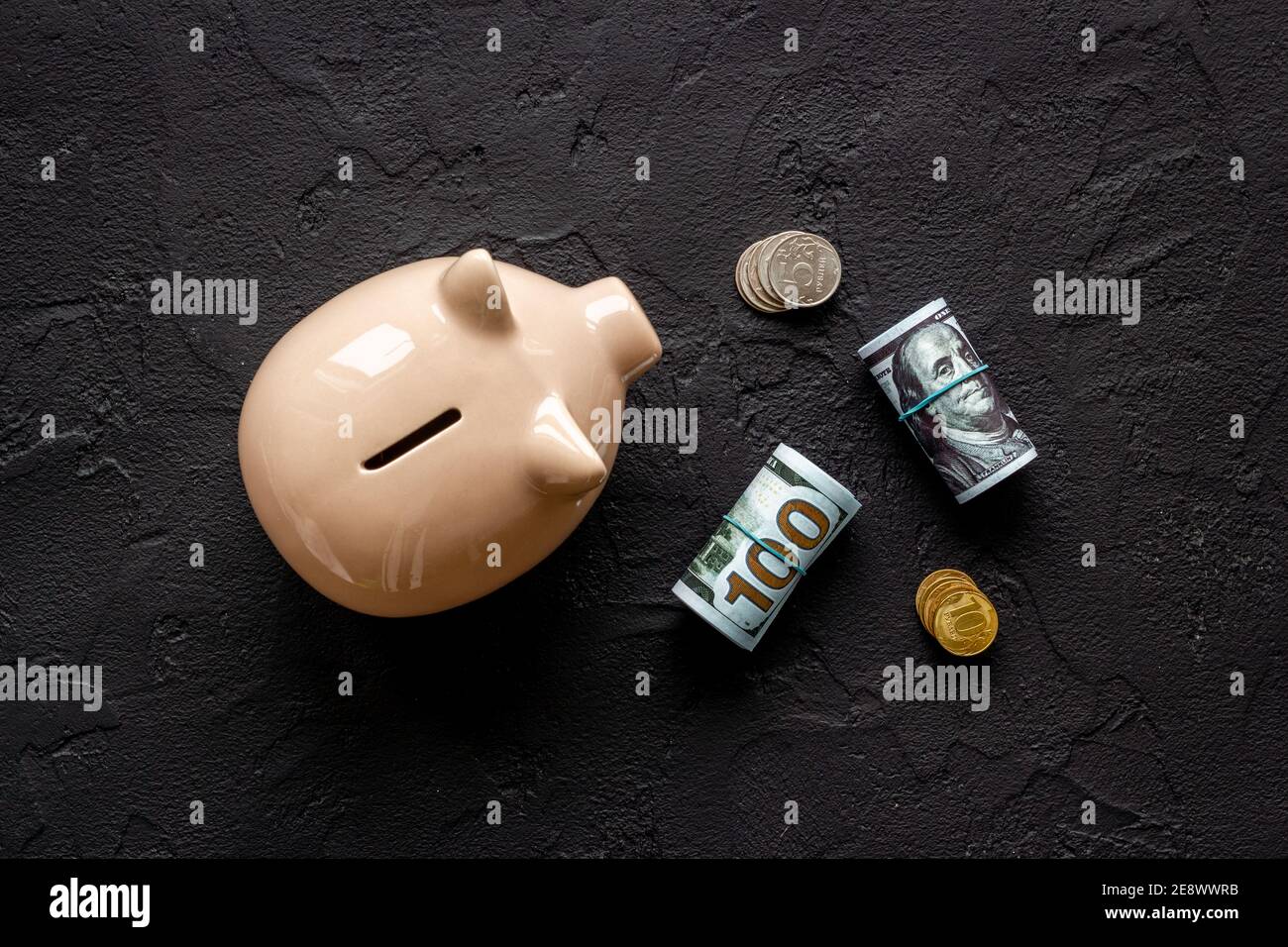 Saving money concept. Piggy bank with cash money and coins. Top view ...
