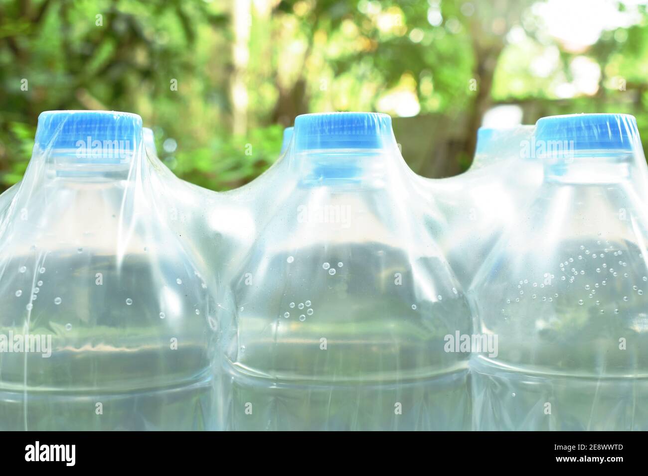 fresh water plastic bottle with blue cap in clear packaging Stock Photo ...