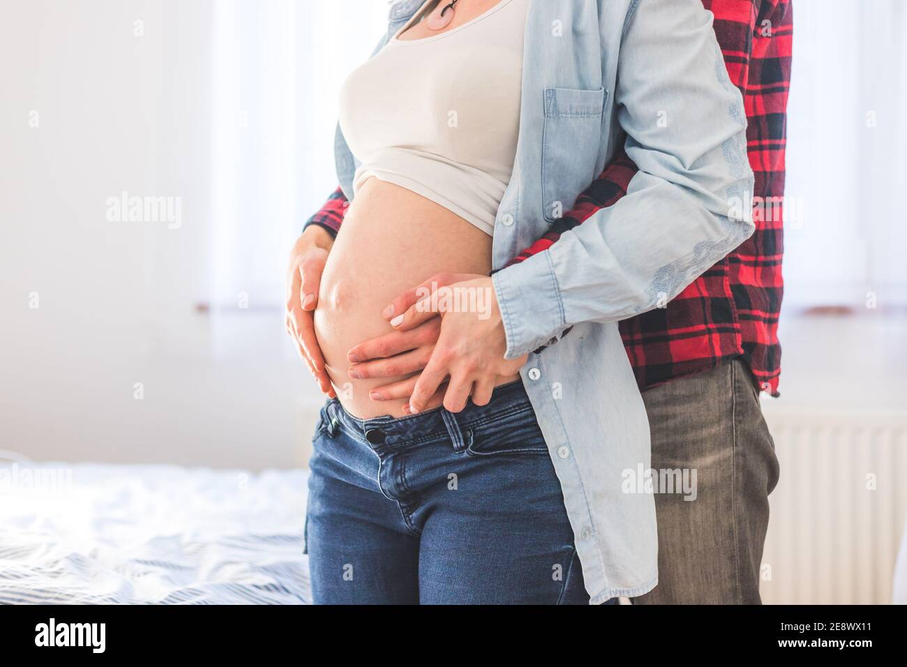 Stomach hugging human hi-res stock photography and images - Alamy