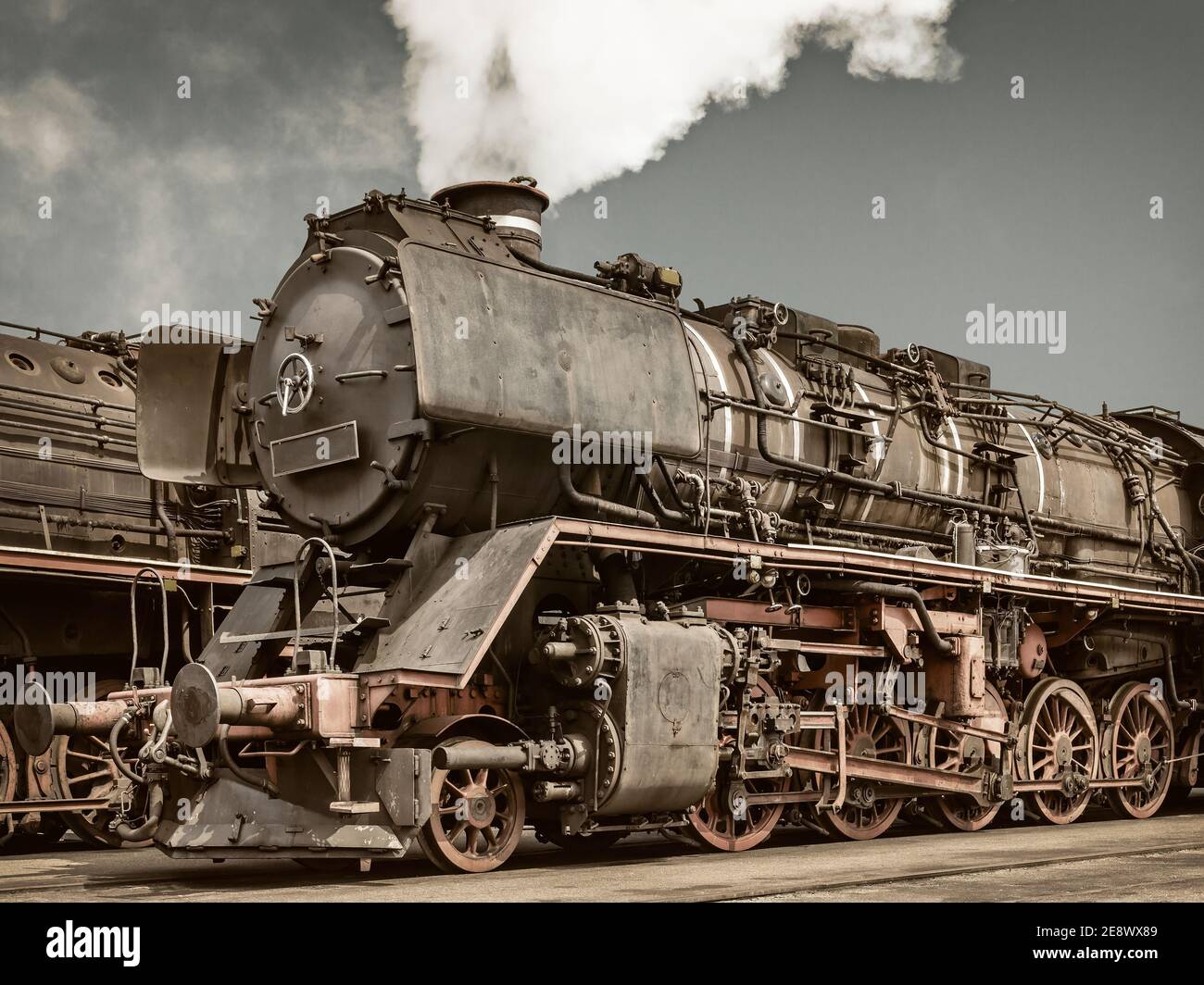 Retro styled side view of an old rusted steam locomotive Stock Photo ...