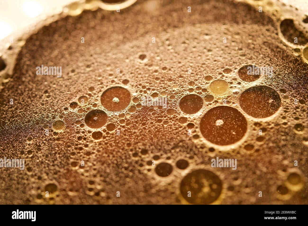 Macro shot of oil drops on soapy water Stock Photo - Alamy
