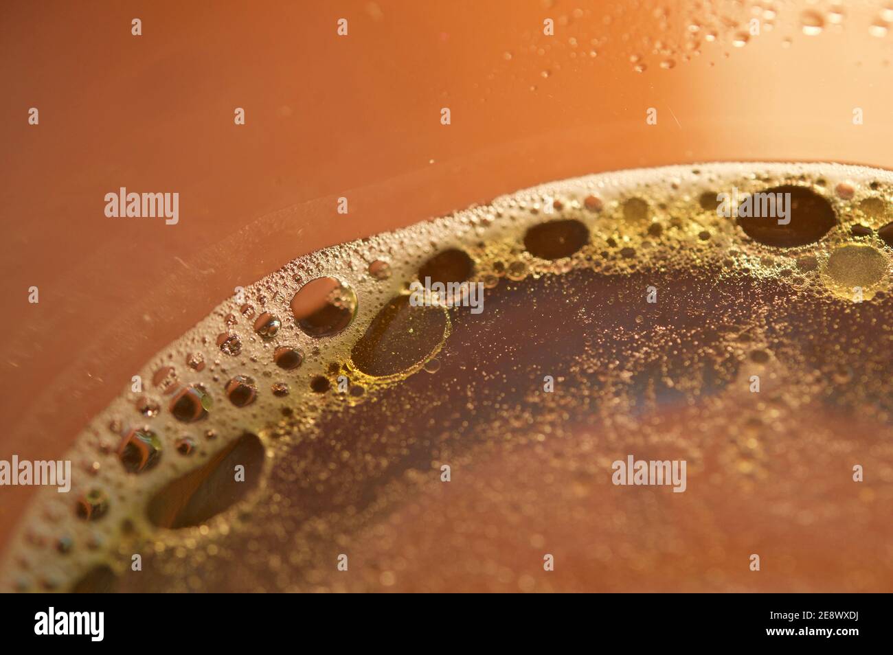 Macro shot of oil drops on soapy water Stock Photo - Alamy