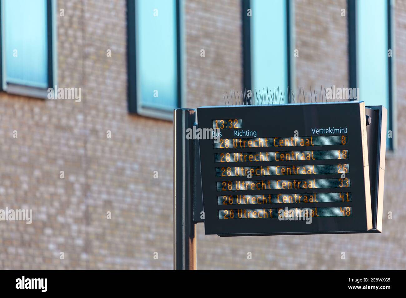 Information panel with Dutch bus departure times in Utrecht Stock Photo ...