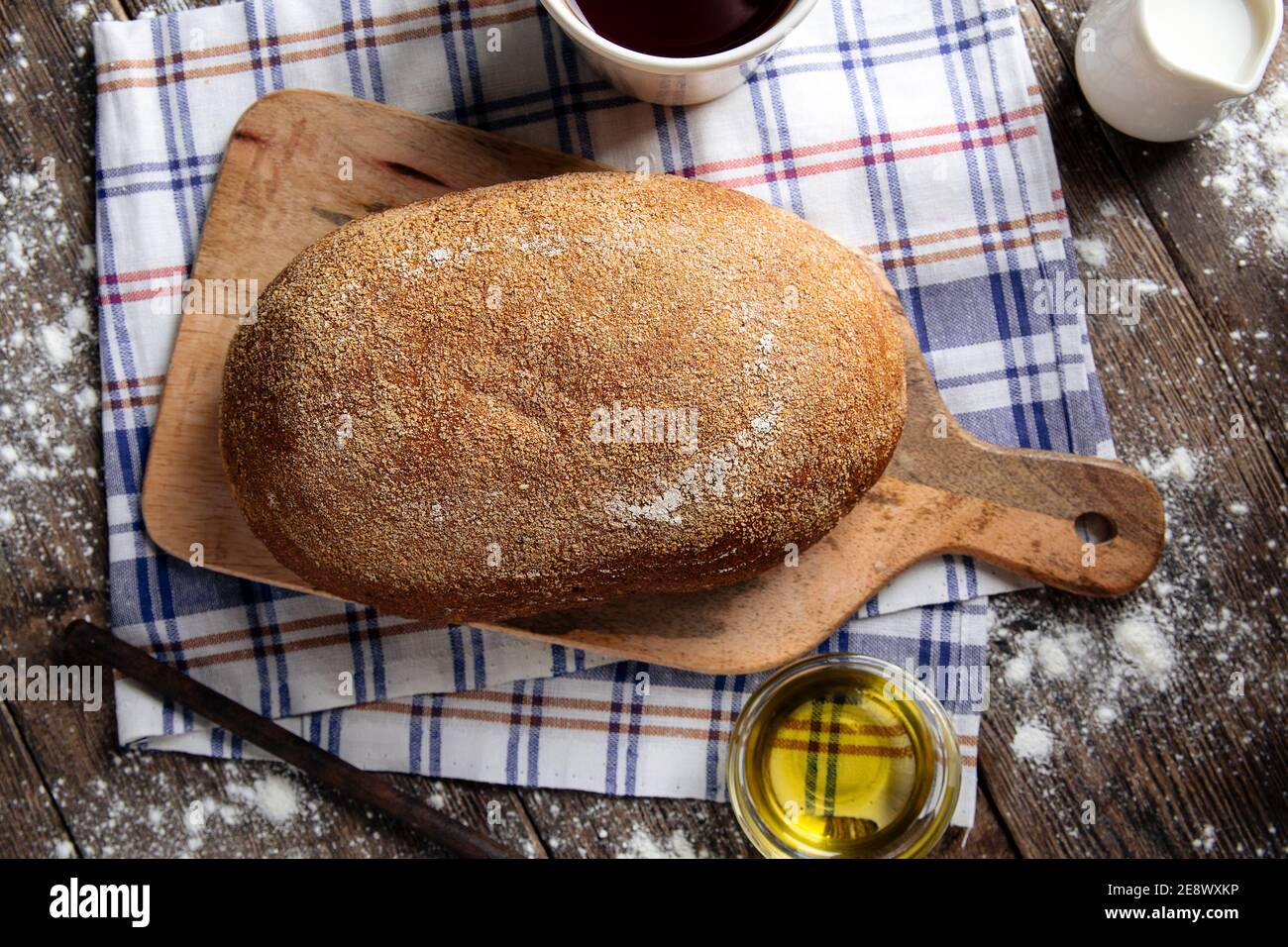 Top view on gray loaf of bread with olive oil Stock Photo - Alamy