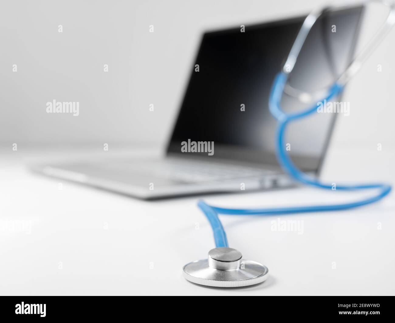 Selective focus of stethoscope and laptop. Laptop diagnosis with ...
