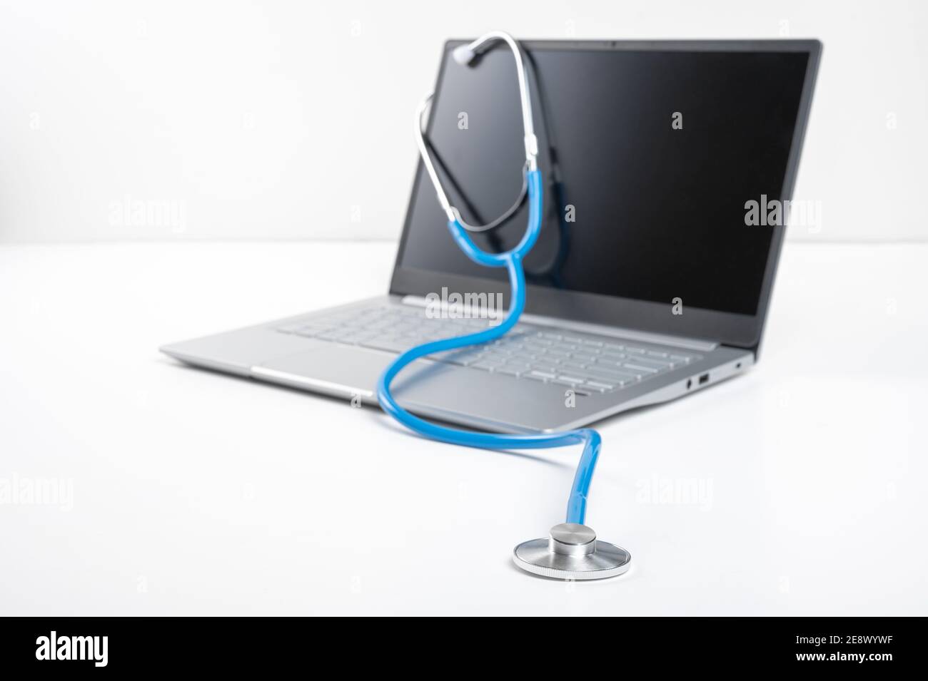 Laptop With Medicine Stethoscope. Doctor desk table with stethoscope ...