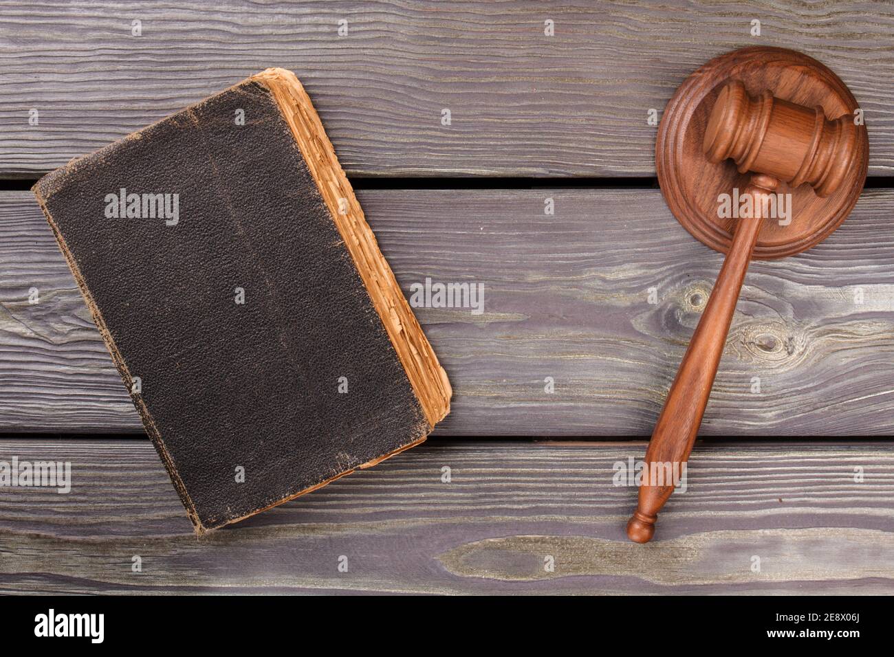 Wooden gavel and old law book Stock Photo - Alamy