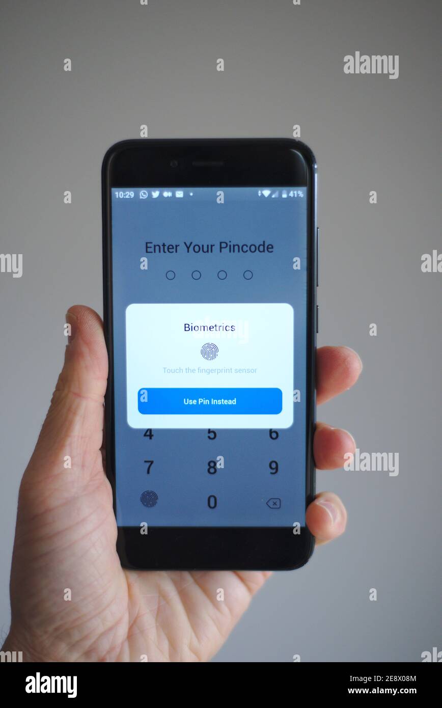 Phone app with biometric fingerprint login enabled Stock Photo - Alamy