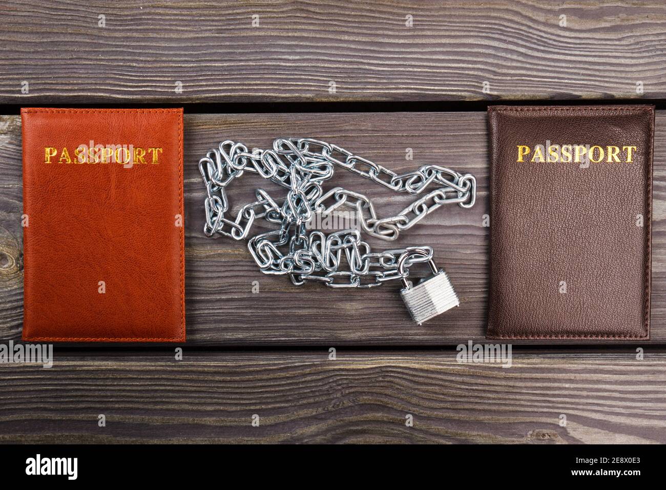 Top view passports and chains with padlock Stock Photo - Alamy