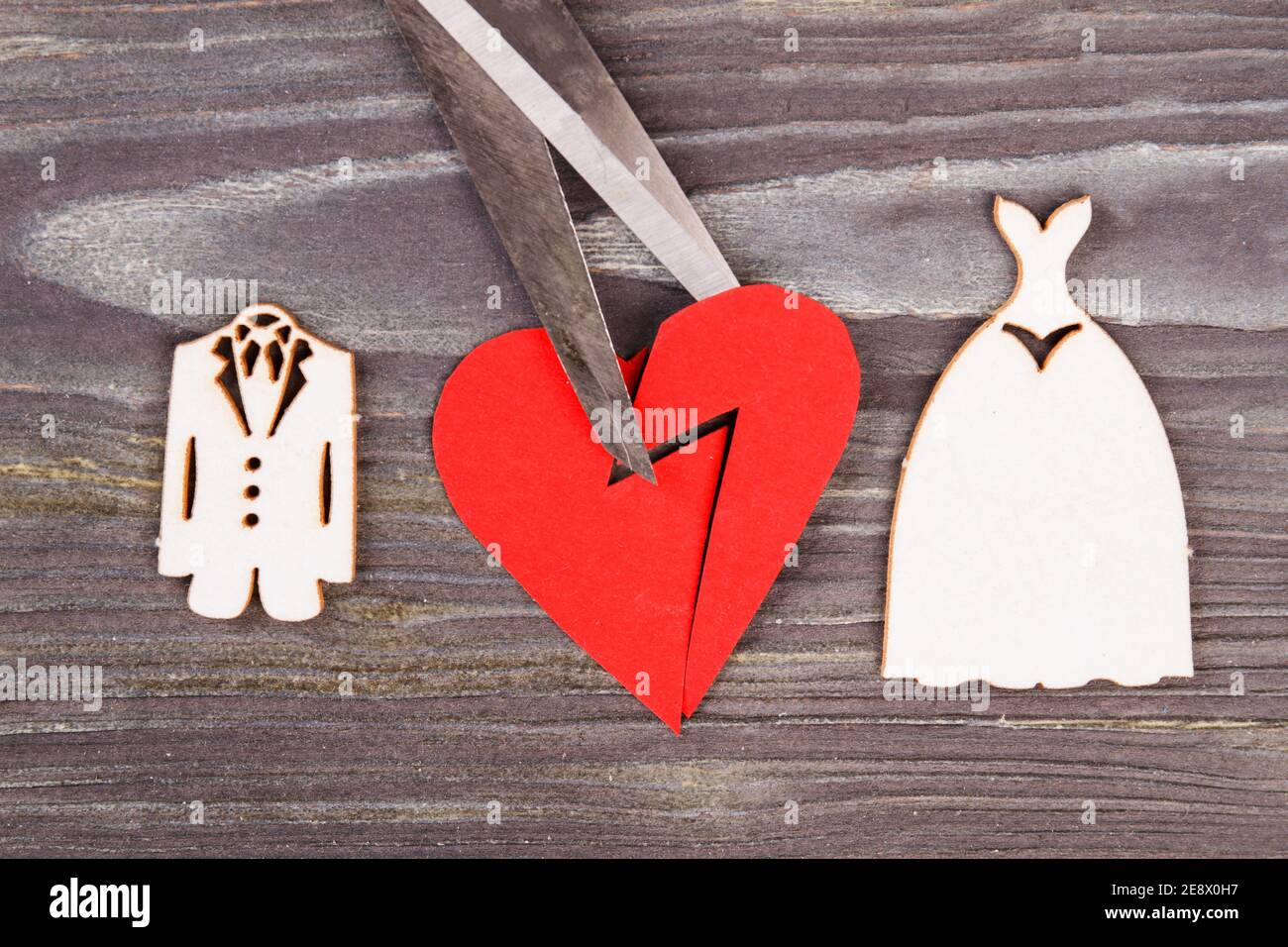 Broken heart with scissors Stock Photo - Alamy