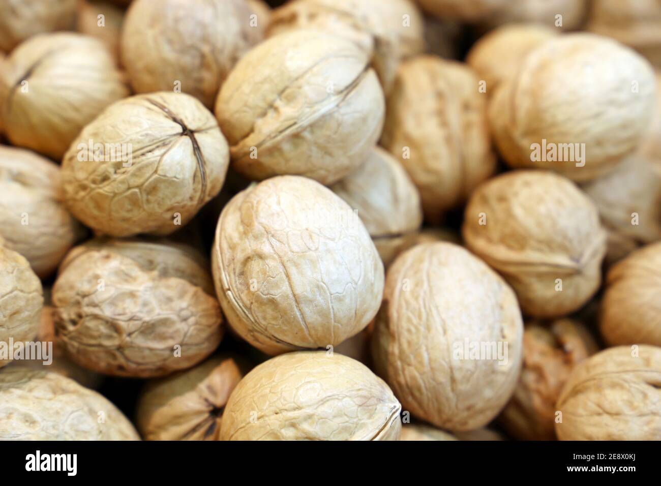 Whole walnuts heap for background. Dry nuts in shells, brain food Stock ... Whole walnuts heap for background. Dry nuts in shells, brain food Stock ...