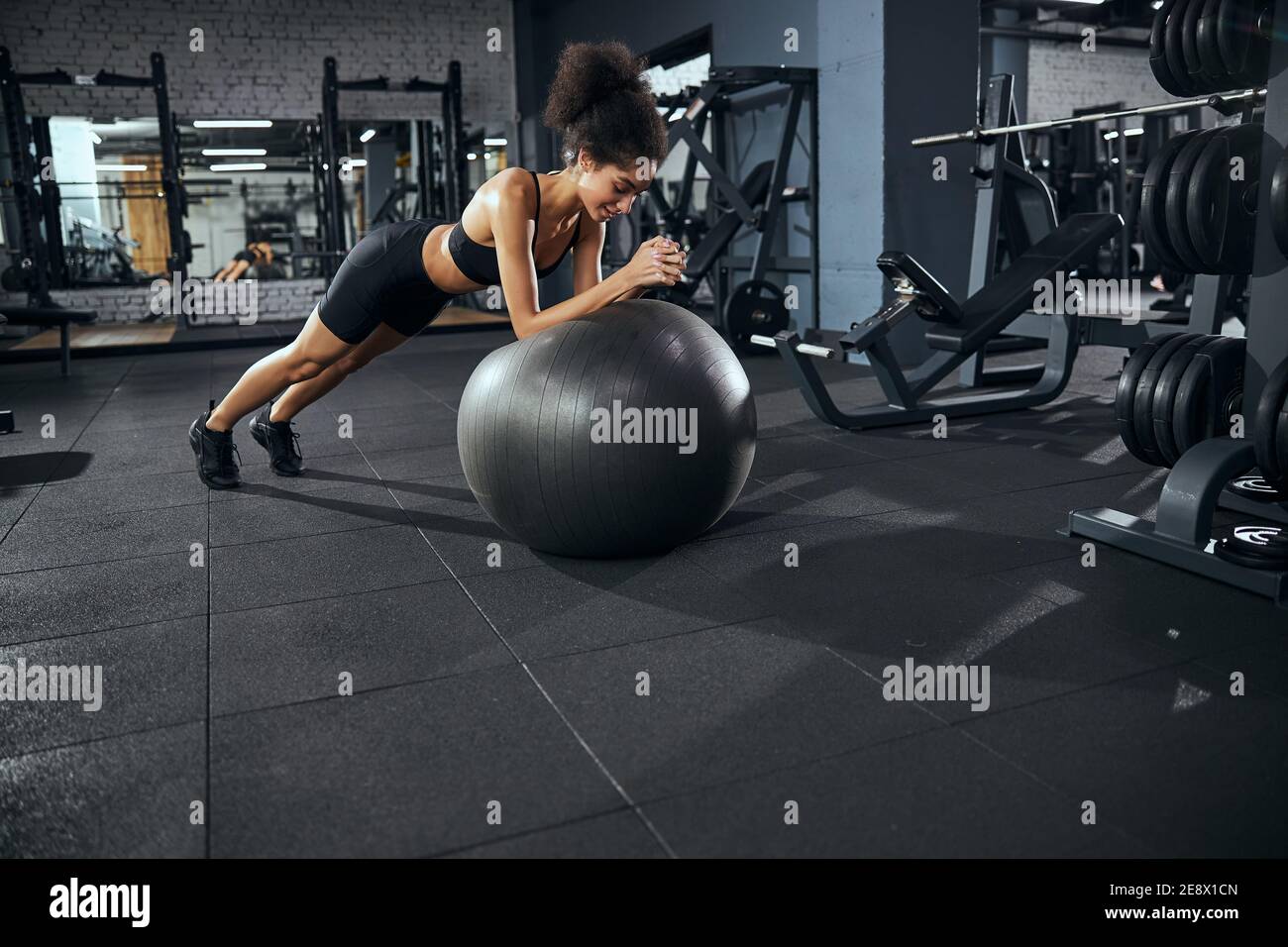 Concentrated young female keeping balance during training Stock Photo ...