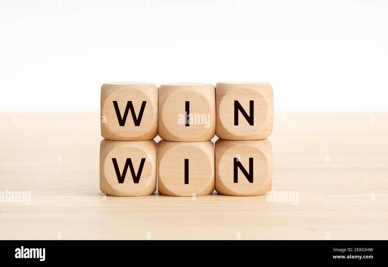 Win Win word on wooden blocks on wood table. Copy space. White ...