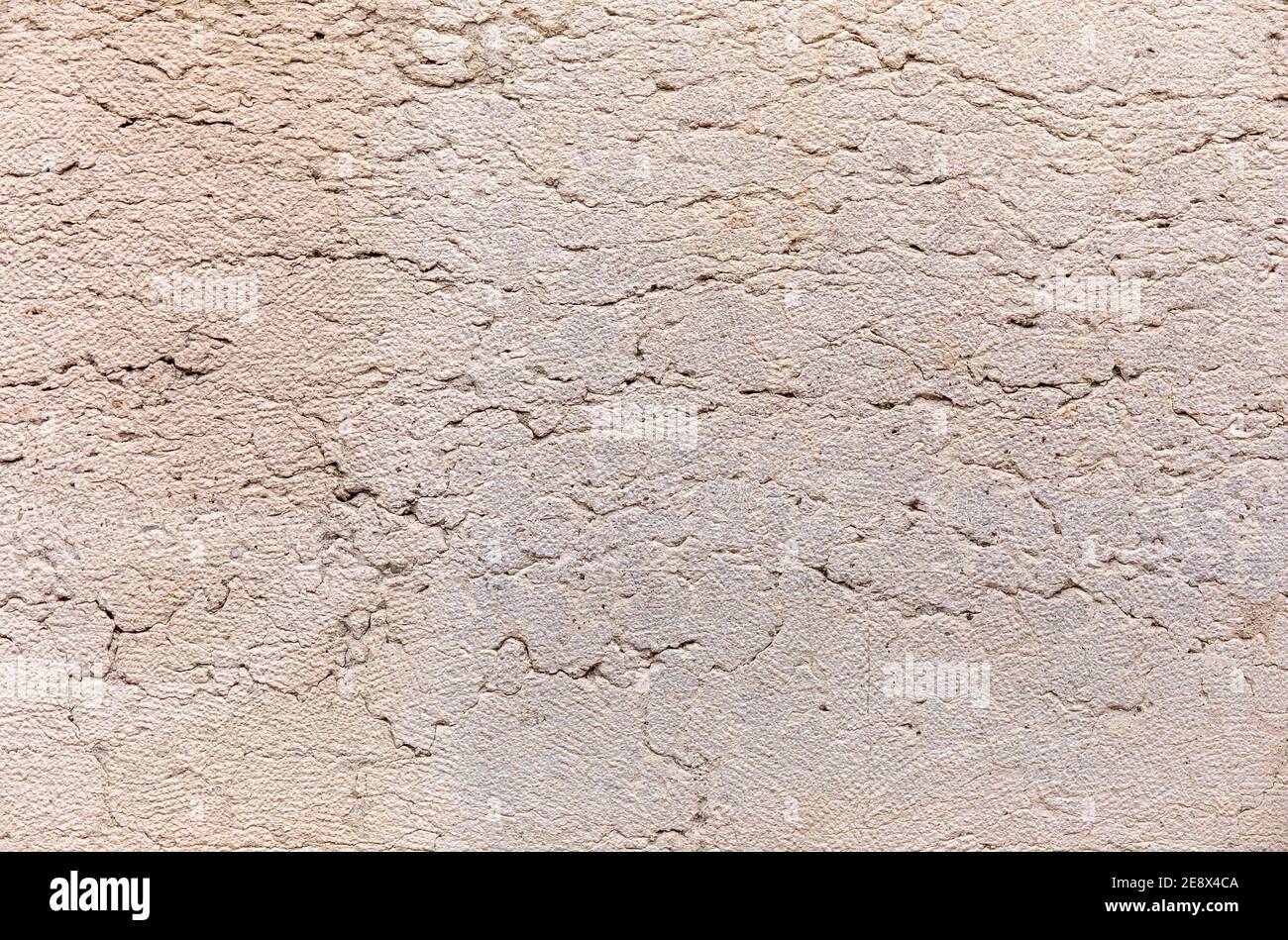 Old beige stucco wall with cracks texture Stock Photo - Alamy