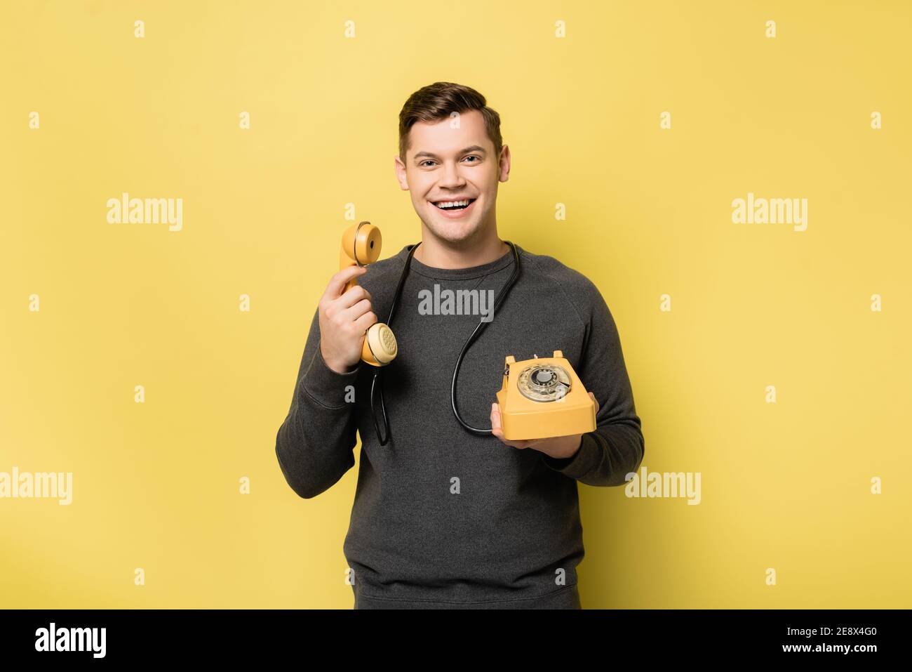 Cheerful man holding retro hi-res stock photography and images - Alamy