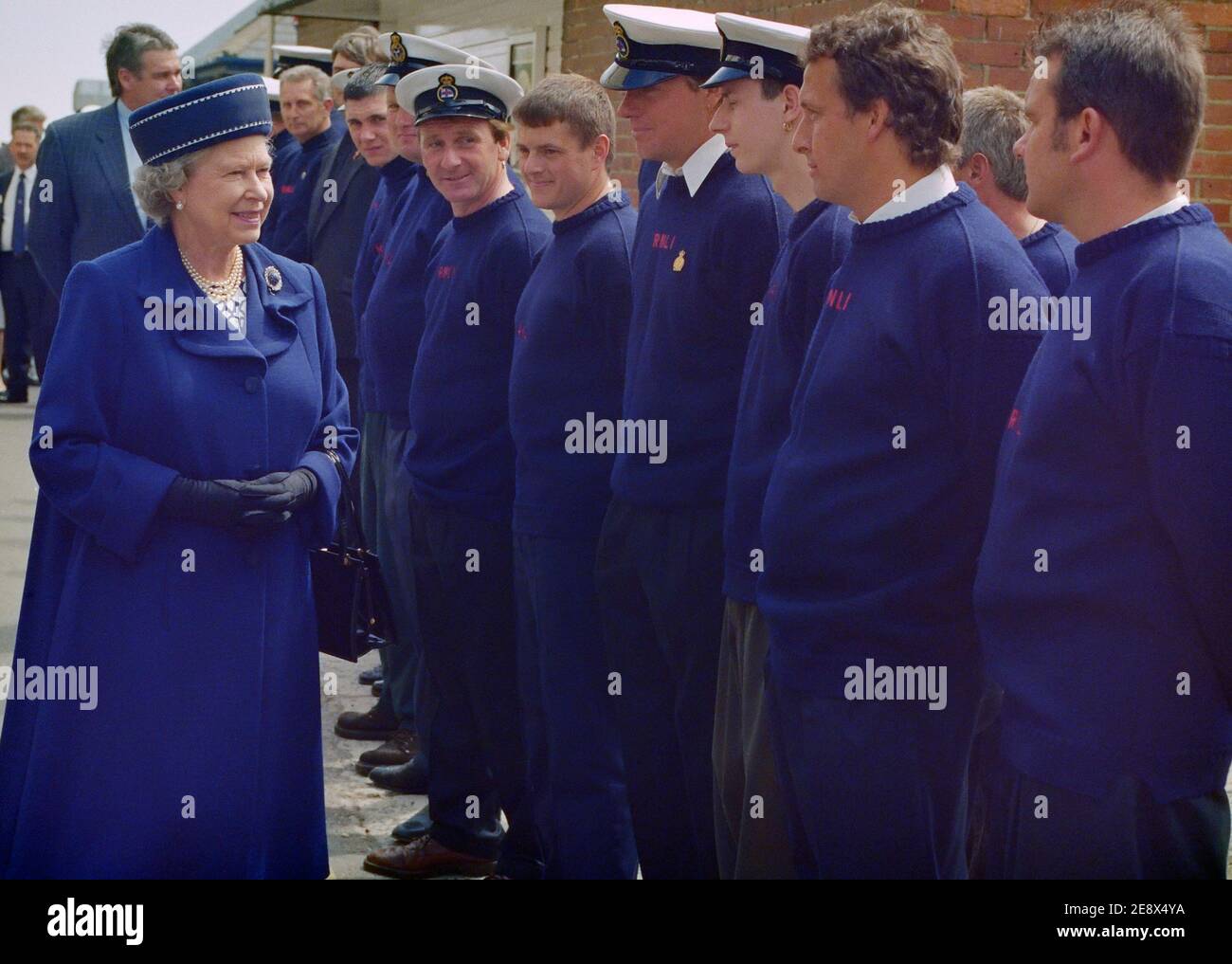 Queen Elizabeth II talking to members of RNLI lifeboatmen on a visit to ...