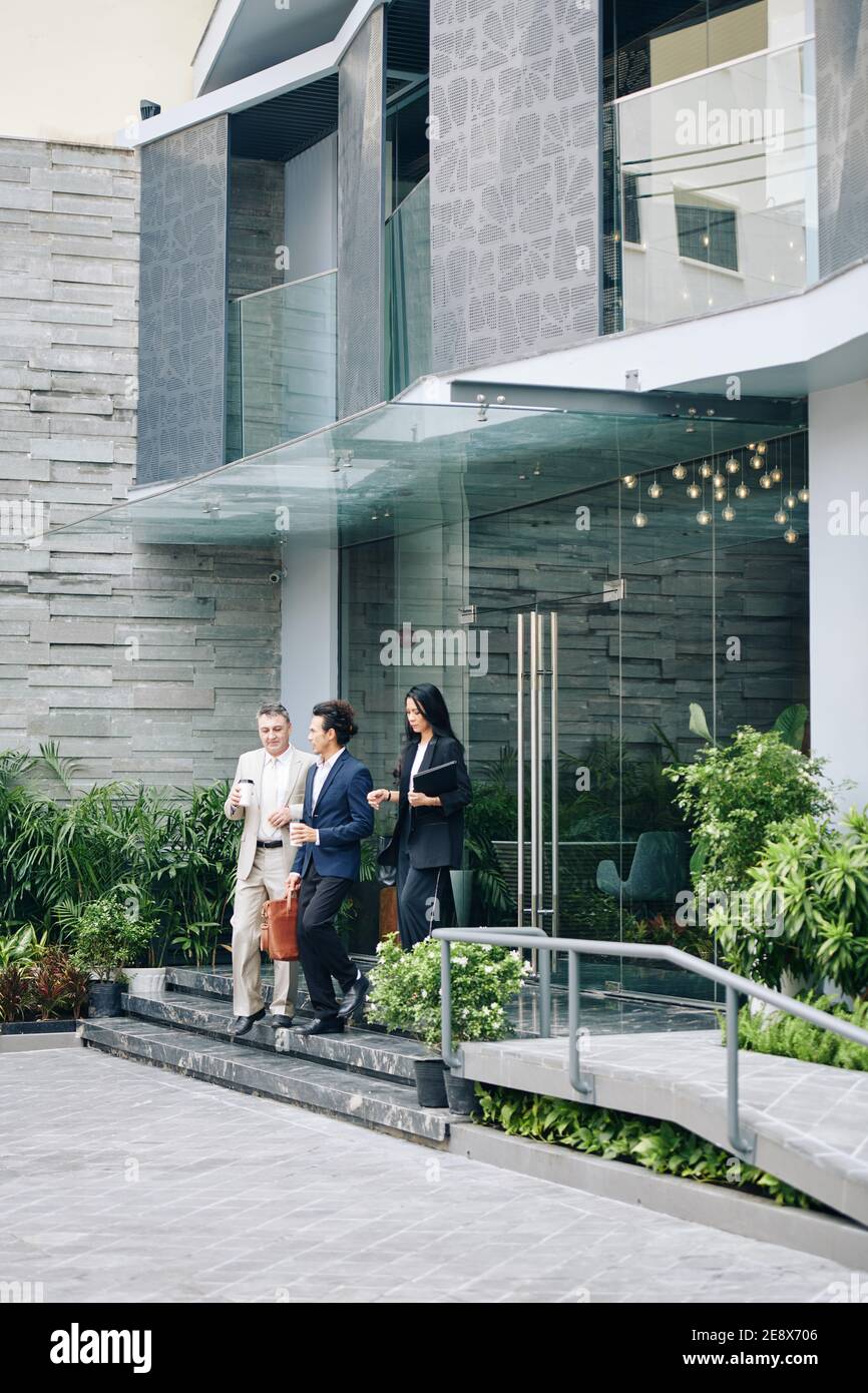 Group business people leaving office hi-res stock photography and ...