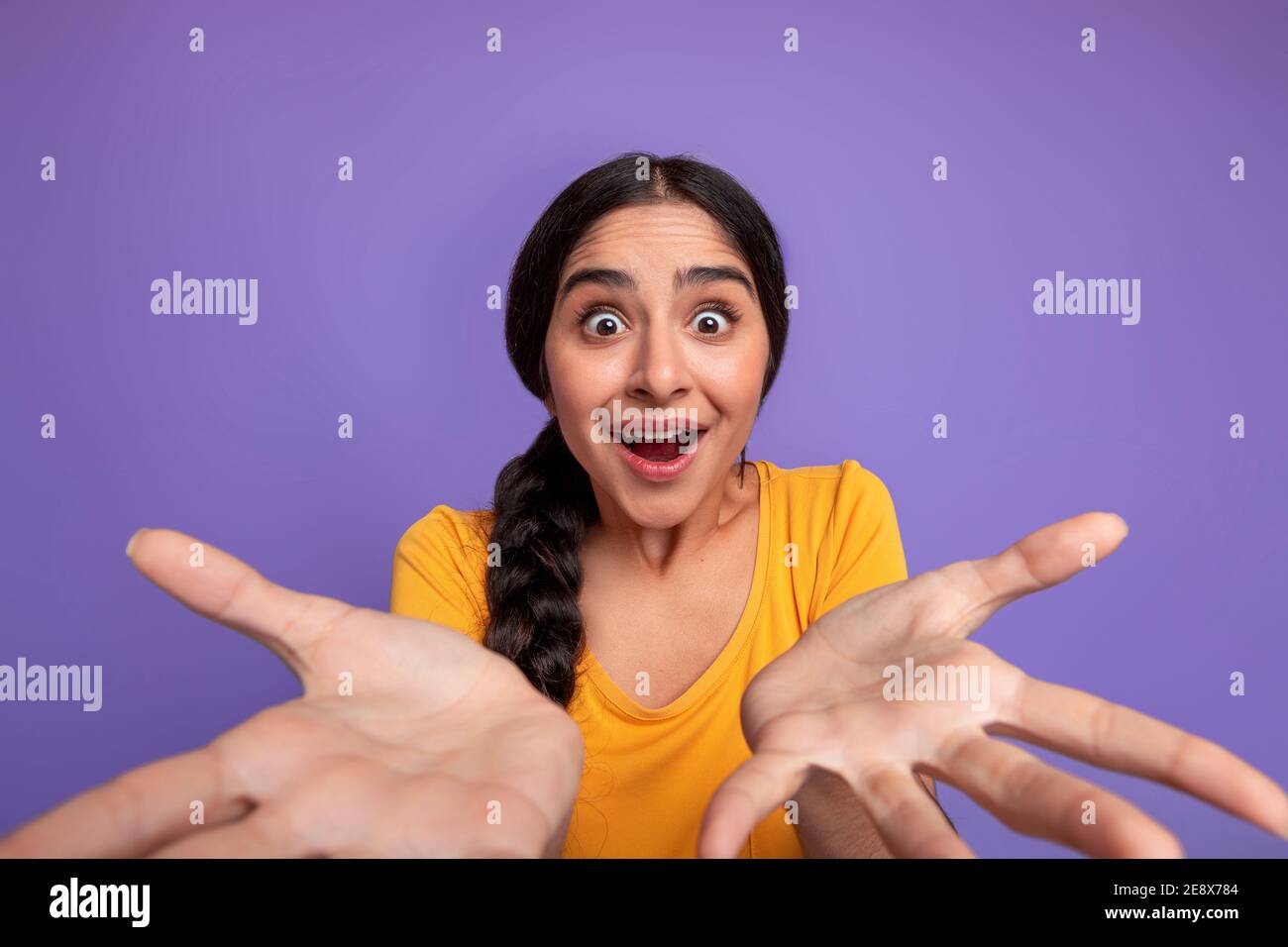 Close up portrait of shocked young indian woman Stock Photo - Alamy
