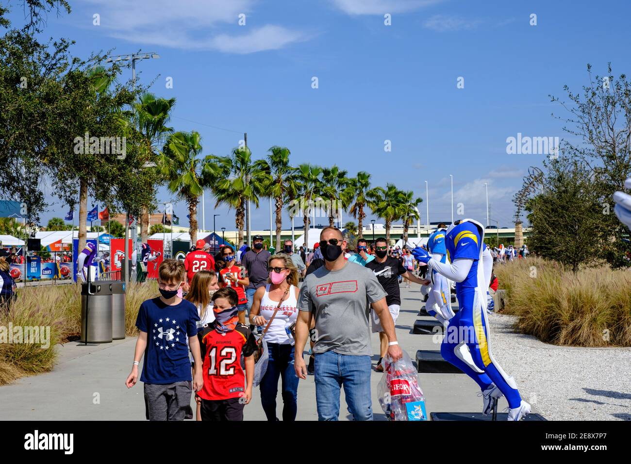 Crowd walking past headless mannequin at the NFL Experience - Super ...