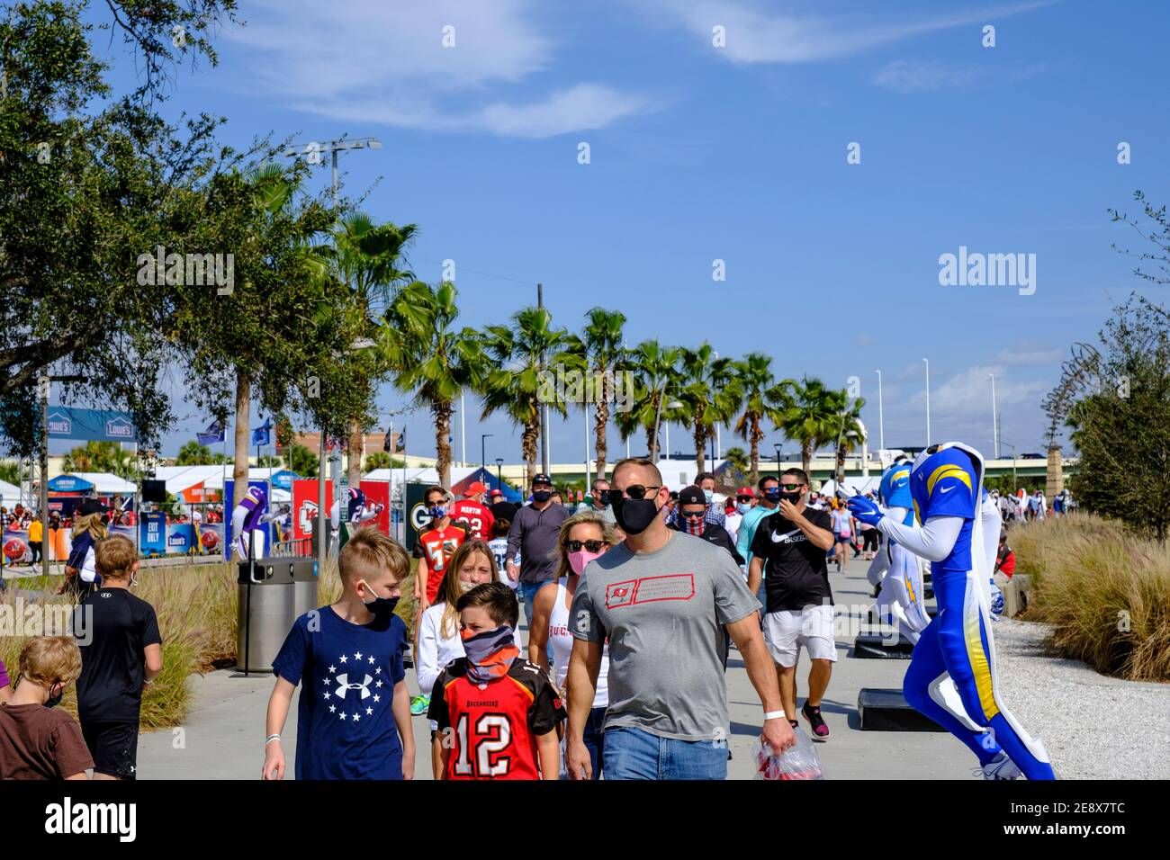 Crowd walking past headless mannequin at the NFL Experience - Super ...