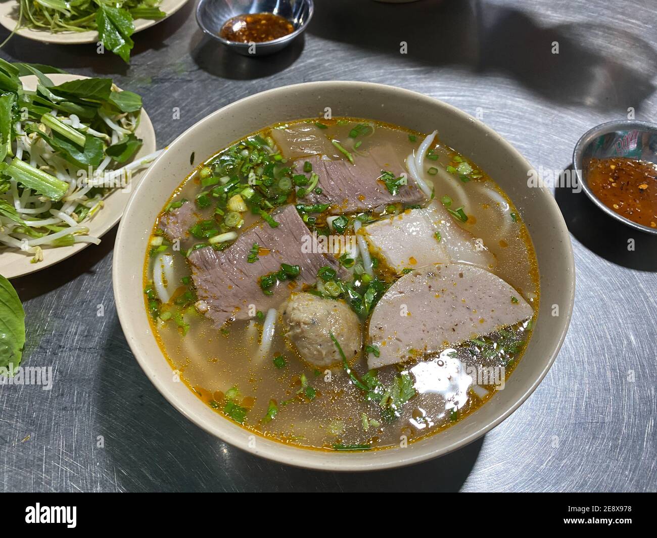 Bowl of Vietnamese Hue style beef noodle - Bun Bo Hue Stock Photo - Alamy