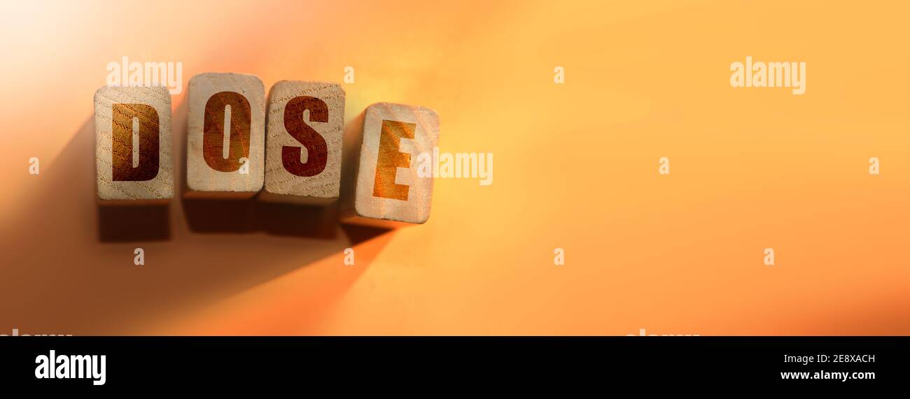 DOSE - text on wooden blocks, medical concept, blue background Stock ...
