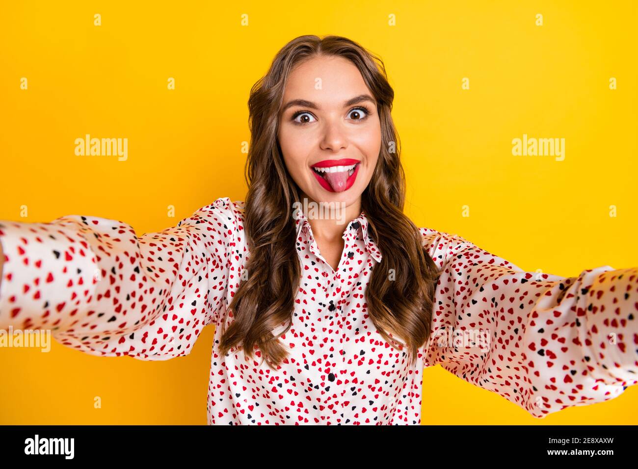 Photo of nice person take selfie tongue out have fun wear heart print ...