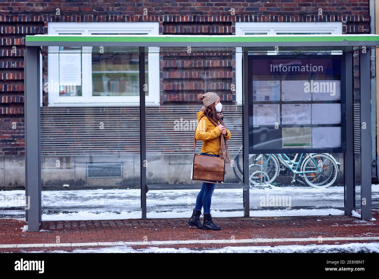 Woman standing bus stop hi-res stock photography and images - Alamy