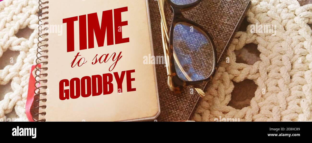 Time to Say Goodbye Text written on notebook page, pencil and glasses ...