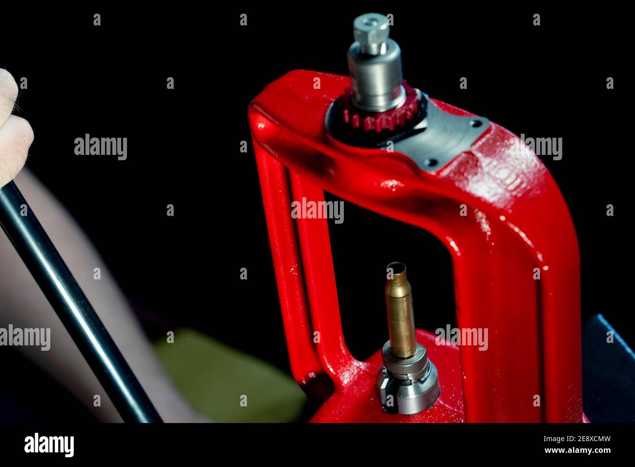 The process of making a rifle cartridge. Hand press and ammo shell ...