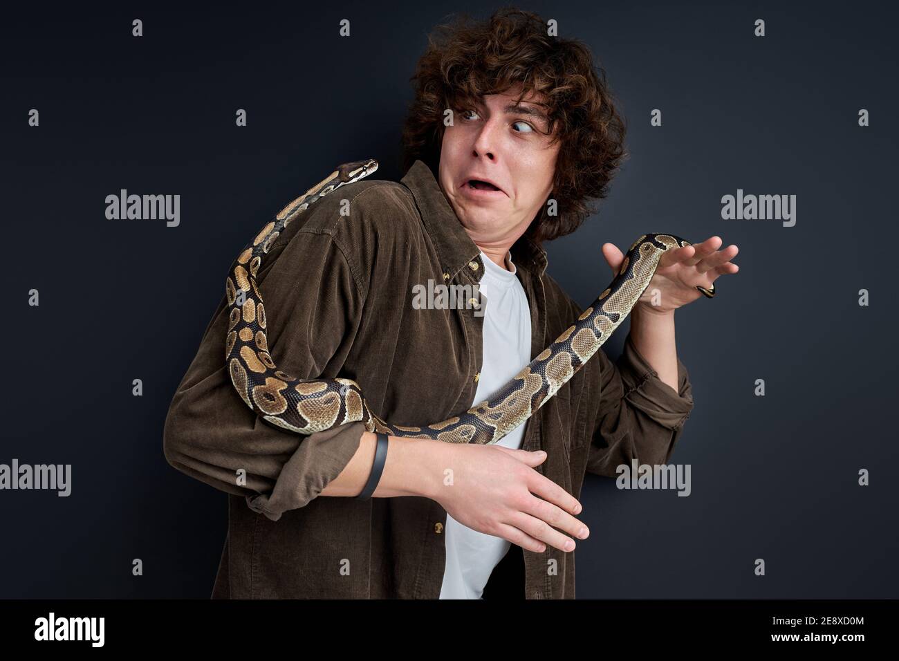 wow. male is emotionally reacts on snake crawling on his body, in shock ...