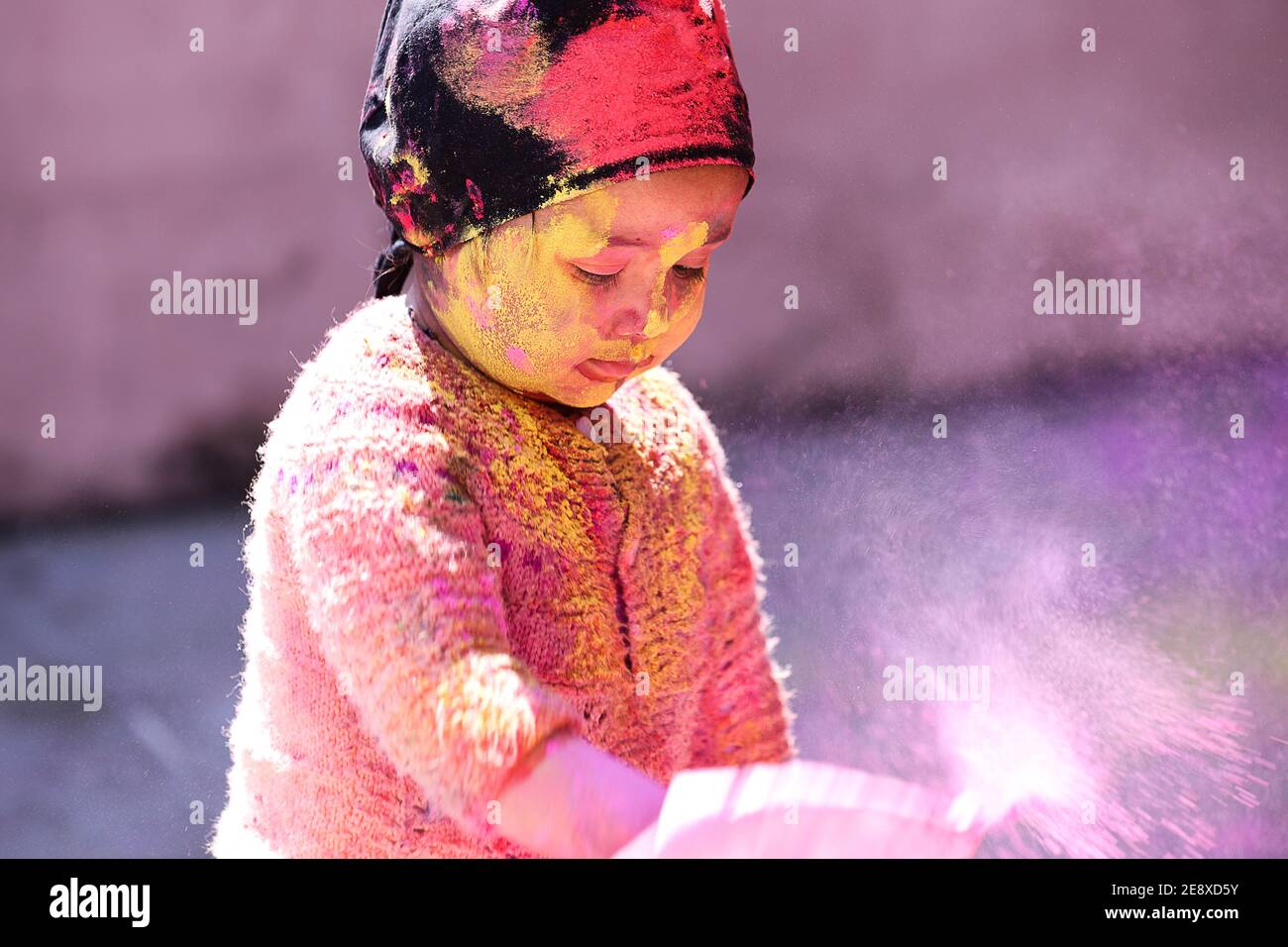Indian kids playing with colours hi-res stock photography and images ...