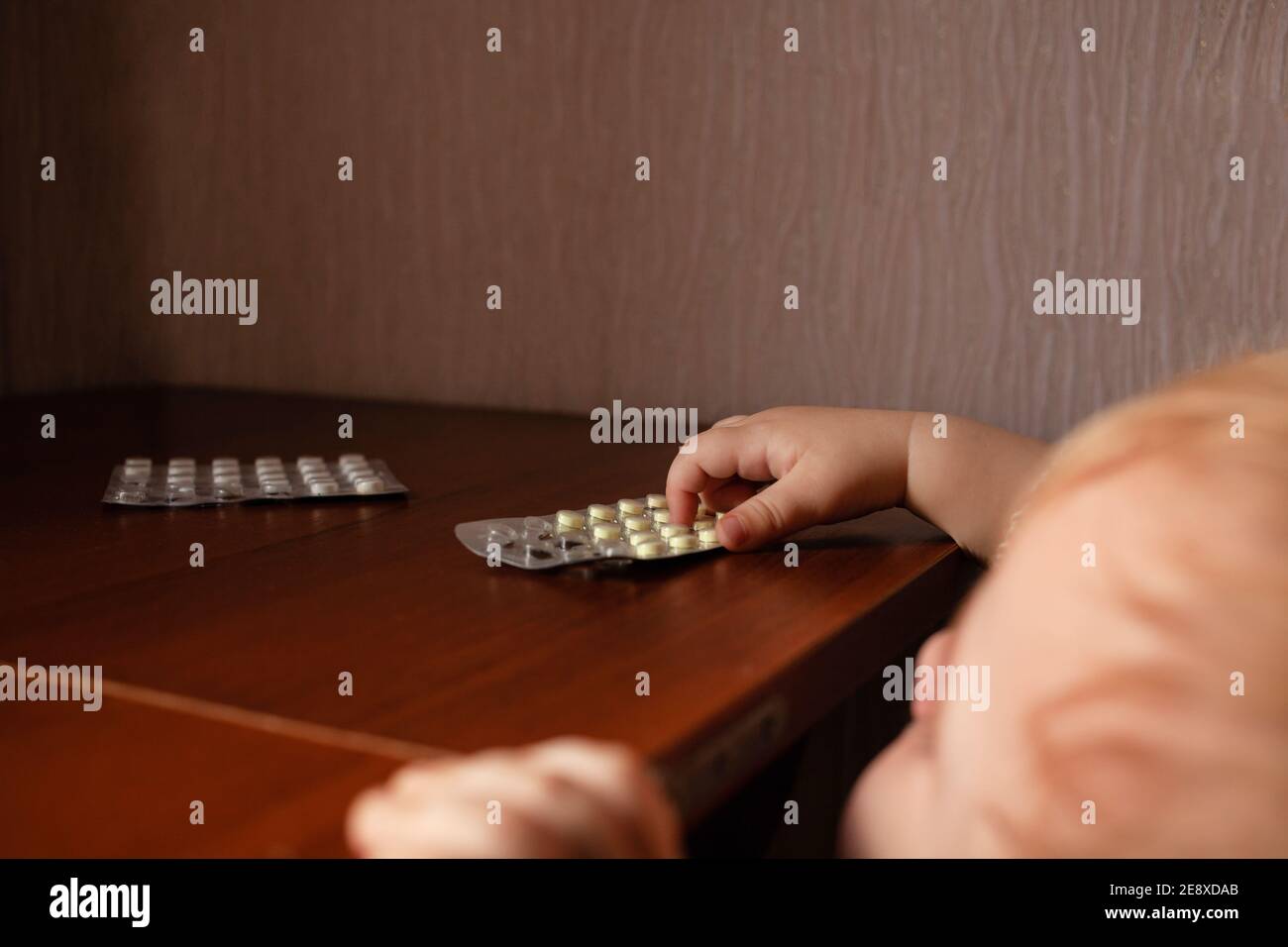 The child took out pills, the girl is playing with medical medicine, a ...