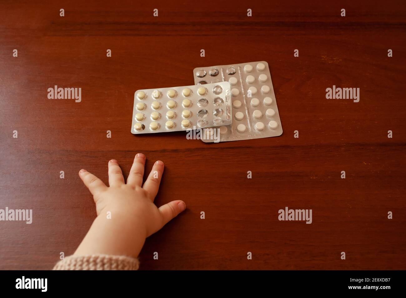 The child took out pills, the girl is playing with medical medicine, a ...