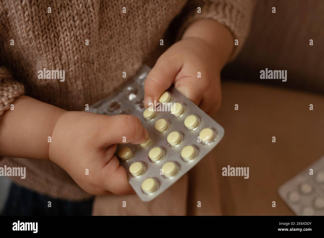 The child took out pills, the girl is playing with medical medicine, a ...