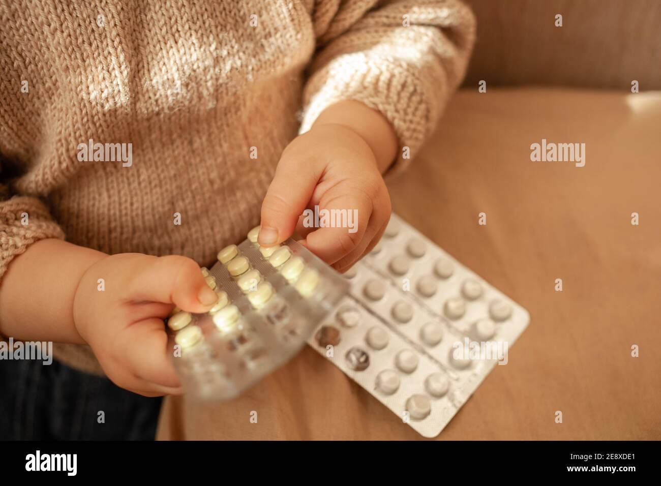 The child took out pills, the girl is playing with medical medicine, a ...