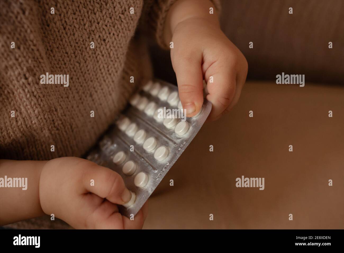 The child took out pills, the girl is playing with medical medicine, a ...