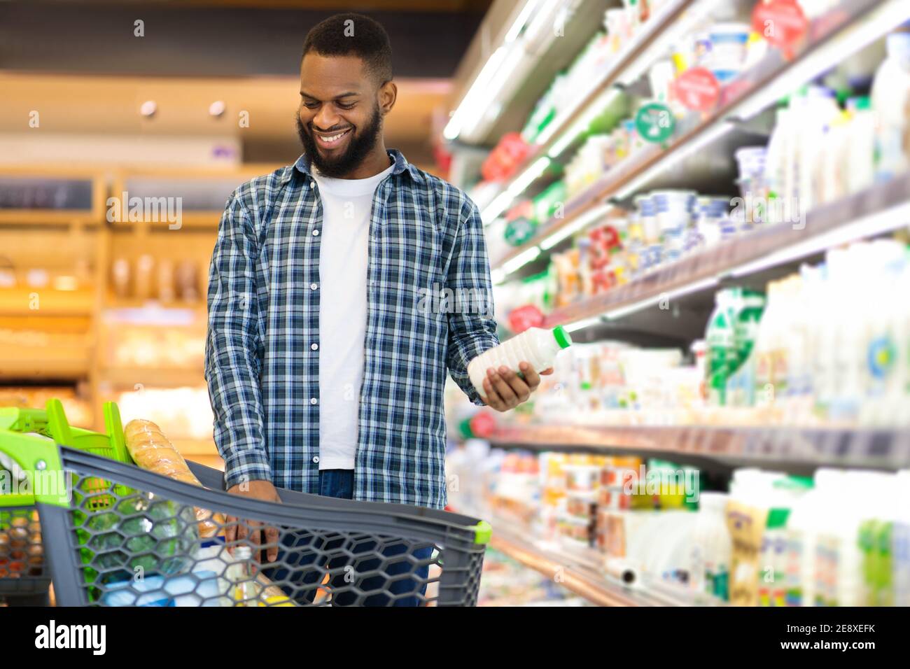Man milk supermarket aisle hi-res stock photography and images - Alamy